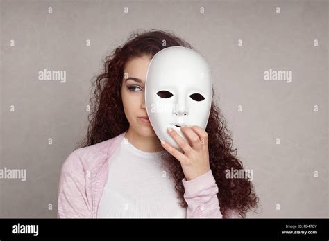 Sad Girl Hiding Behind Mask Stock Photo Alamy