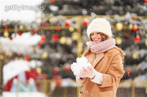 Beautiful Woman Next To The Christmas Fair