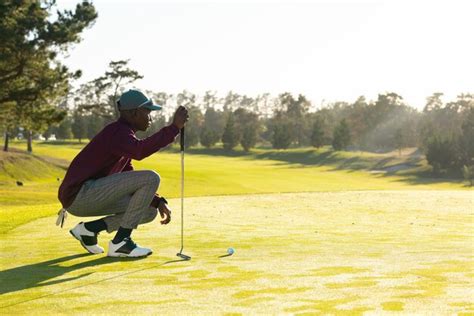 Premium Photo African American Young Man With Golf Club And Ball