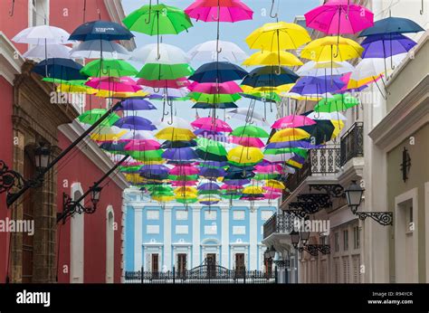 Colorful Umbrellas Suspended Above Streets Of Old San Juan And The
