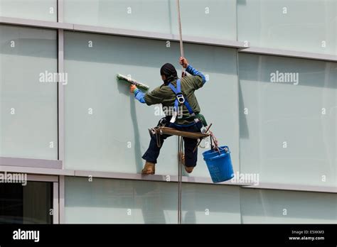 High Rise Window Cleaner Sitting In A Bosun S Chair USA Stock Photo Alamy