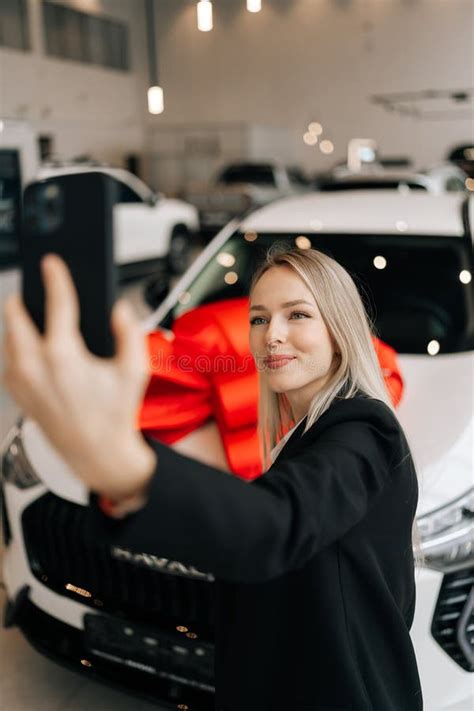 Vertical Shot Of Happy Female Customer In Black Suit Doing Selfie Shot