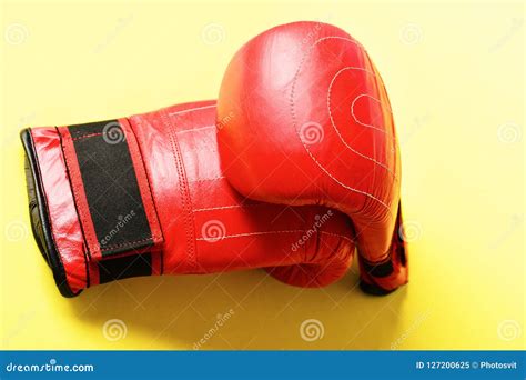 Two Red Boxing Gloves Made Of Leather On Light Yellow Stock Image