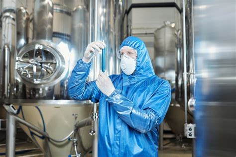 Worker Wearing Protective Gear And Holding Test Tube At Chemical Plant Stock Image Image Of