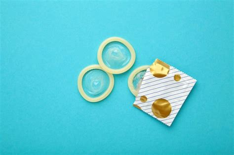 Premium Photo Opened Condom In Pack On Blue Background A Condom Use