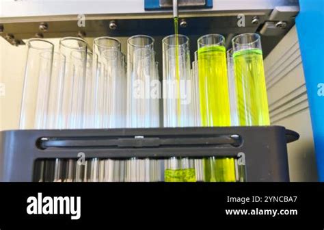 Green Fluorescent Compound Is Separated In Automated Machine Test Tube
