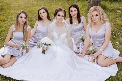 Group Portrait Of The Bride And Bridesmaids A Bride In A Wedding Dress