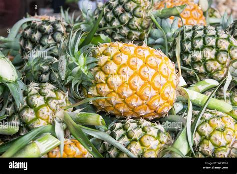 Pile Of Pineapples At The Market Stock Photo Alamy