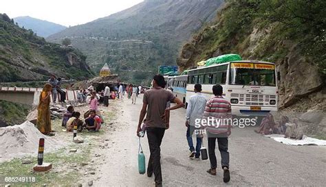 Indian Travellers And Motorists Gather After A Landslide Blocked