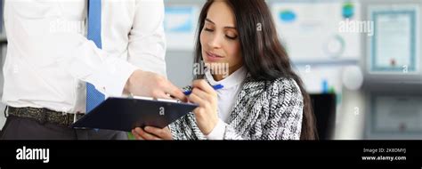 Man Giving Contract Paper To Businesswoman To Sign Worker Give Agreement Paper To Boss Stock