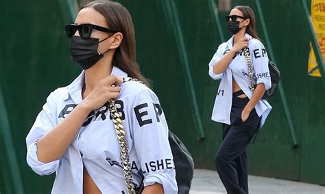 Irina Shayk Teases Her Taut Midriff In A Partially Unbuttoned Shirt As