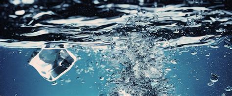 Premium Photo Water Splashing And Ice Cube Ice Splashing Into A Glass Of Water Underwater