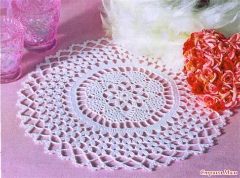 Crocheted Doily And Vases On Pink Table Cloth