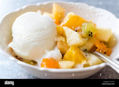 Fruit Salad With Vanilla Ice Cream In Ceramic Bowl Ready To Eat Stock