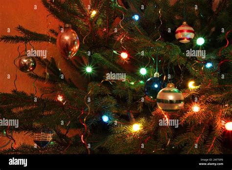Christmas Fir Tree With Baubles And Switched On Lights Decorated Ready