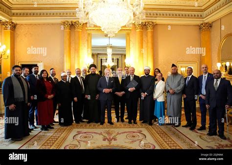 king charles iii centre poses for a photograph with faith leaders at