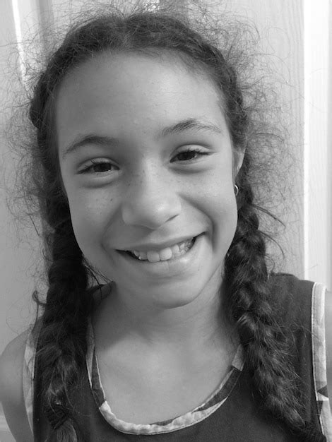 Premium Photo Close Up Portrait Of Cheerful Girl By Wall