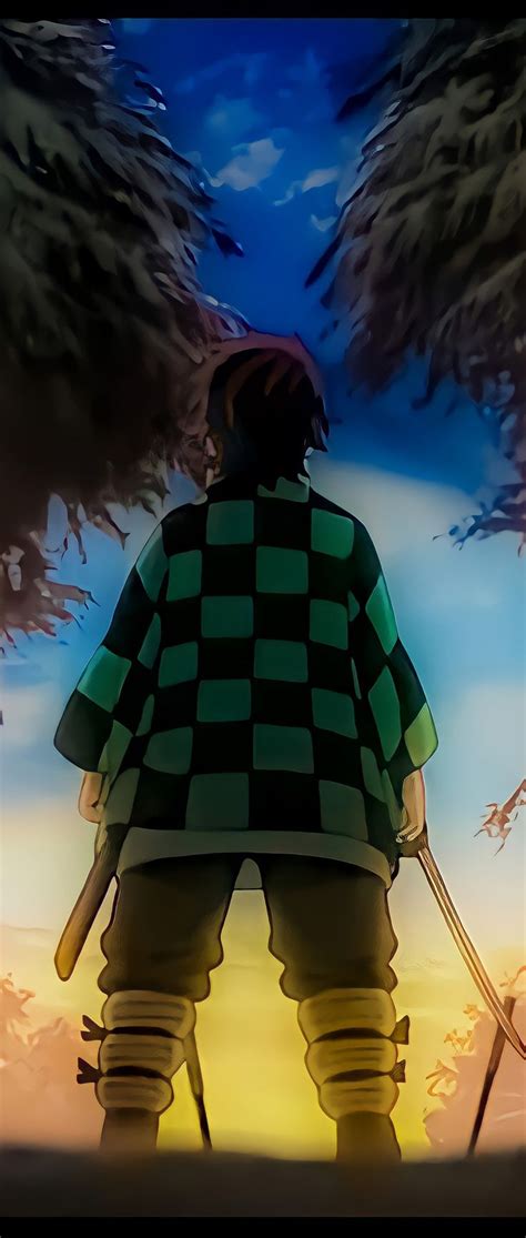A Man Standing In Front Of Trees With Skis On His Feet And Wearing A