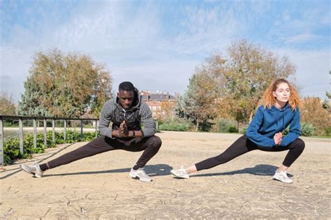 African Black Man And Redhead Caucasian Woman Smiling And Taking A