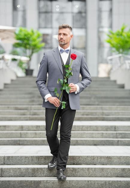 Premium Photo Elegant Man In Tux Man Wearing Tux Bowtie Walk Outdoor Handsome Tux Man With Red
