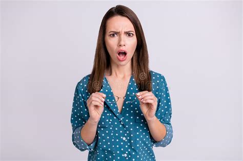 Photo Of Impressed Scared Young Lady Wear Dotted Shirt Arms Glasses