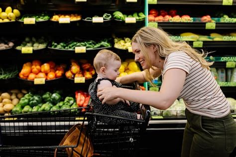 Premium Photo Caucasian Mother And Daughter Grocery Shopping For Organic Vegetables