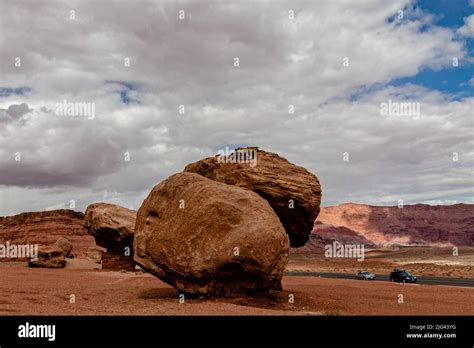 Giant Boulders Shown With Human Cars For Comparison By The Side Of The