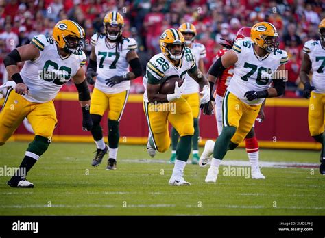 Green Bay Packers Running Back Aj Dillon Runs With The Ball During The