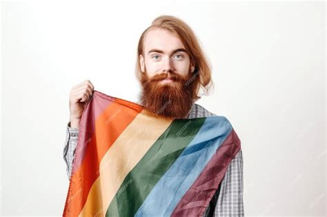 Premium Ai Image Proud Gay Man Holding A Rainbow Flag While Isolated