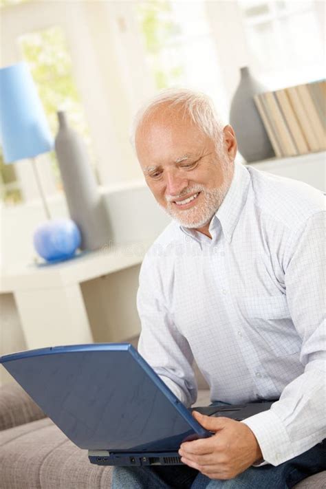 Smiling Elderly Man Looking At Computer Screen Stock Photo Image Of