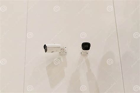 Closed Circuit Camera Small Cctv Attached On White Wall With Light And
