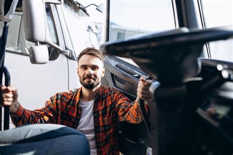 Premium Photo Man Trucker Driving In A Cabin Of His Truck