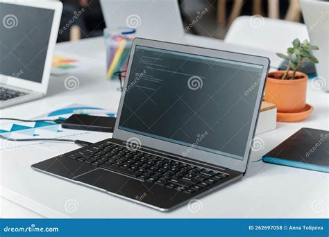 Laptop With Codes On Monitor At Office Stock Photo Image Of Office
