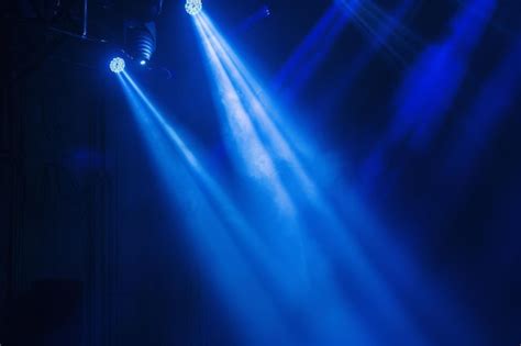 Premium Photo Spotlights Illuminate Empty Stage Blue Background