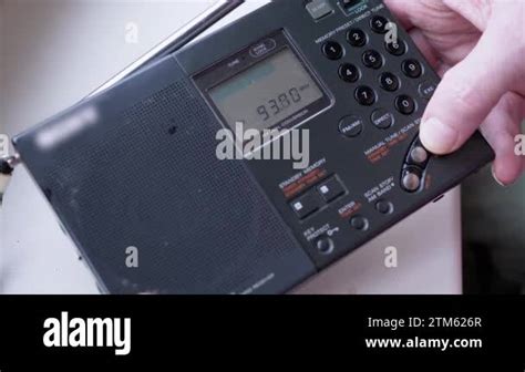 Finding A Frequency On A Black Dusty Modern Portable Digital Radio