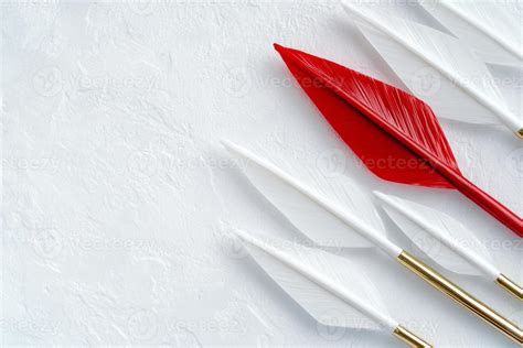 A Striking Red Arrow Contrasts Against White Arrows Symbolizing
