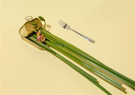 Premium Photo Still Life Of Gold Tin Can Full Of Fresh Grass And Pink