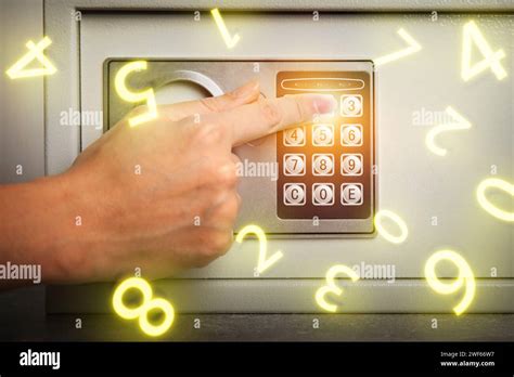 Woman Pressing Buttons On Keypad To Lock Steel Safe Closeup Numbers Symbolizing Code