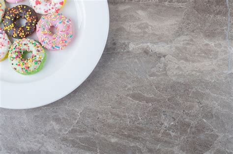 Free Photo Snack Size Donuts Served On A White Platter On Marble Surface