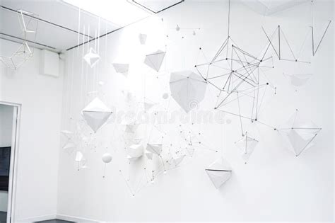 kinetic and interactive geometric art installation in modern