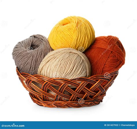 Different Balls Of Woolen Knitting Yarns In Wicker Basket On White