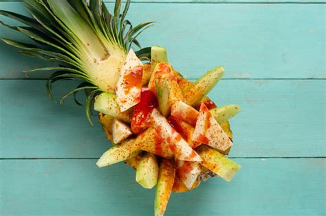 Cucumber Jicama And Pineapple With Chili Powder And Chamoy Sauce On