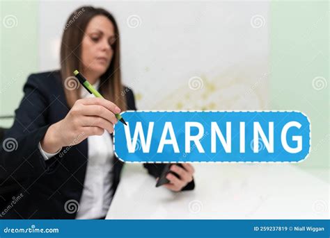 Hand Writing Sign Warning Word For Statement Or Event That Indicates A Possible Or Impending