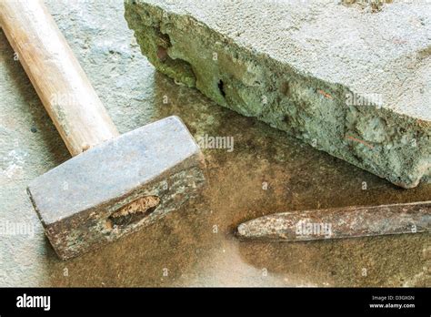 Bricklayer Tools Chisel Hammer And Block Construction Background