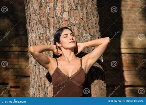 South American Woman Young And Beautiful Brunette With Brown Dress