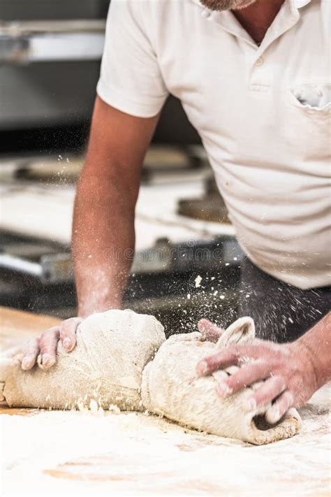 A Baker Kneads Bread Dough In The Bakery Stock Image Image Of