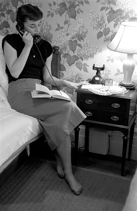 Actress Audrey Hepburn Double Crossing Her Legs In Long Skirt And