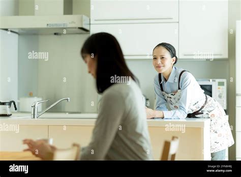 Mother Watching Her Daughter Stock Photo Alamy