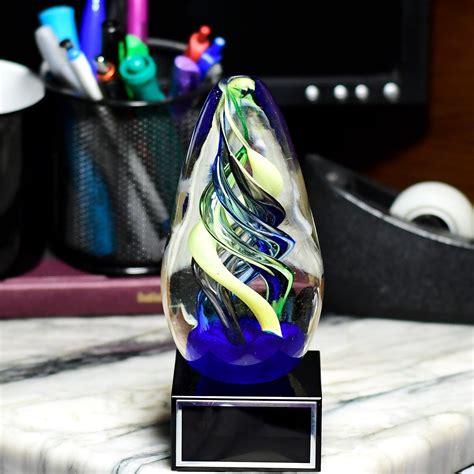 Art Glass Egg On Black Glass Base
