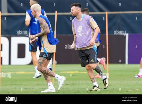 Argentinas Lionel Messi Right And Rodrigo De Paul Warm Up During A